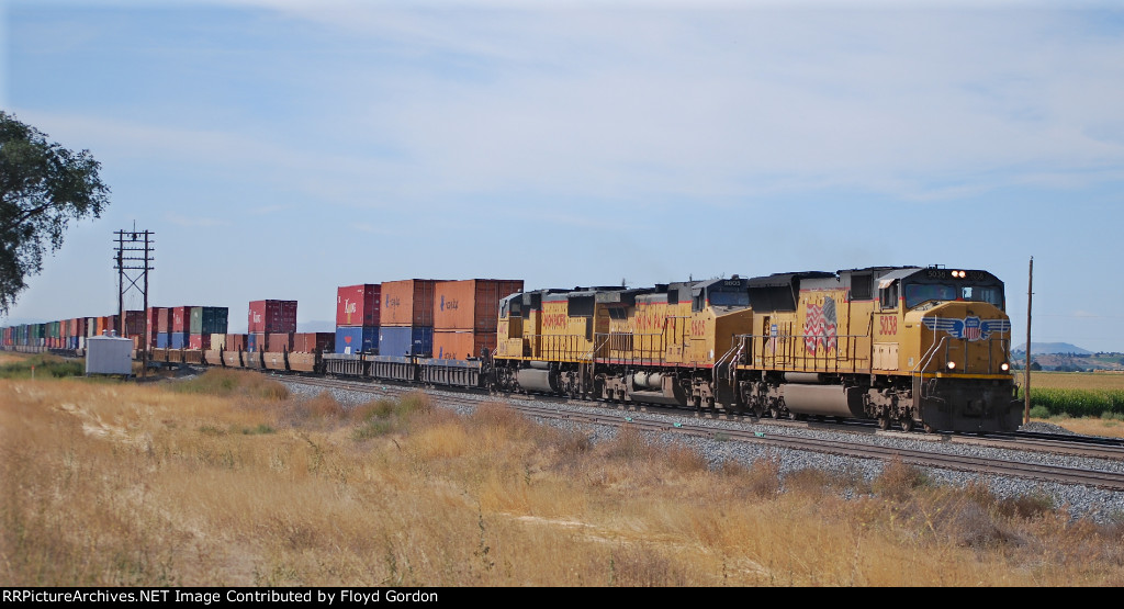 UP 5038 leads double stack as it heads west